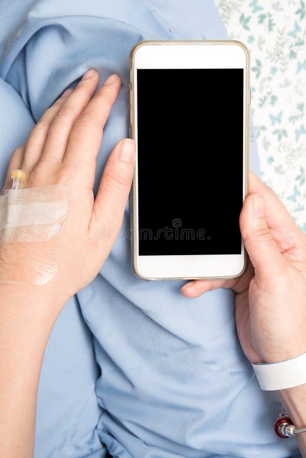 Patient Using Smart Phone in Hospital Stock Photo - Image of injection ...