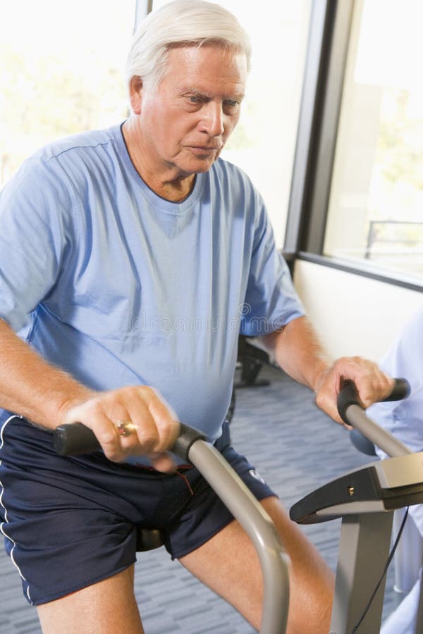 Patient Working Out on Exercise Machine Stock Photo - Image of ...