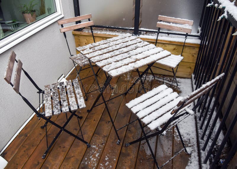 Patio set covered in snow stock photo. Image of cheap - 147063490
