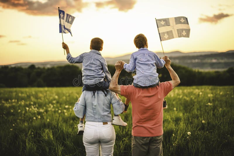 A Patriotic Family Waving Quebec Flags on Sunset Stock Image - Image of ...