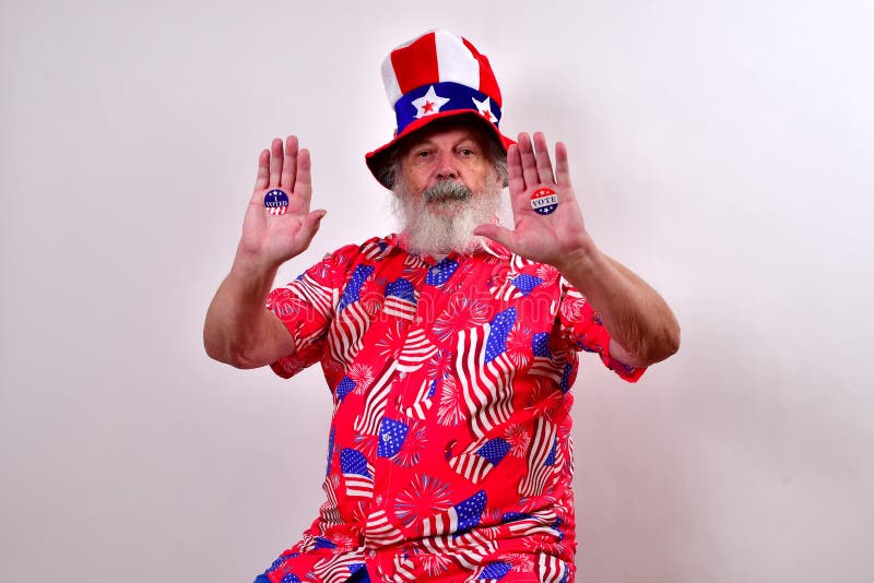 Patriotic Man with Funny Uncle Sam Hat Showing His I Voted Stickers ... Patriotic Man with Funny Uncle Sam Hat Showing His I Voted Stickers ...