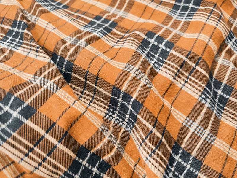 The Pattern and Background of the Fabric Has a Orange Checkered Motif ...