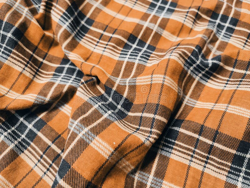 The Pattern and Background of the Fabric Has a Orange Checkered Motif ...