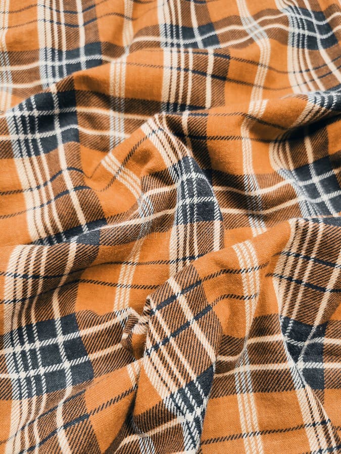 The Pattern and Background of the Fabric Has a Orange Checkered Motif ...