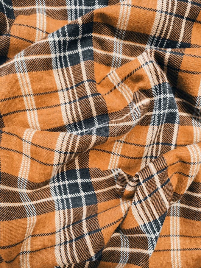 The Pattern and Background of the Fabric Has a Orange Checkered Motif ...