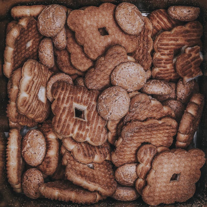 Pattern of Biscuits of Various Shapes Inside a Square Box of Reflective ...
