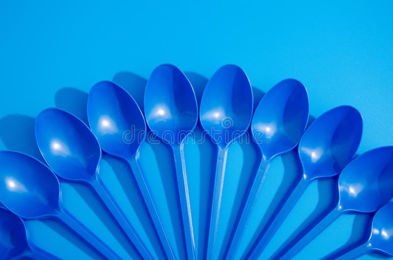Pattern of Blue Plastic Spoons on Blue Background. Blue Color of 2020 ...