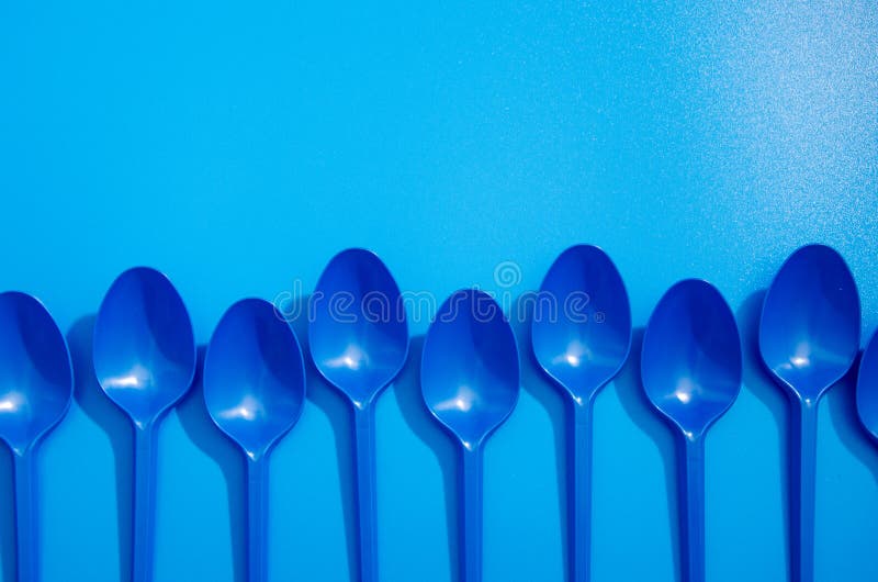 Pattern of Blue Plastic Spoons on Blue Background. Blue Color of 2020 ...