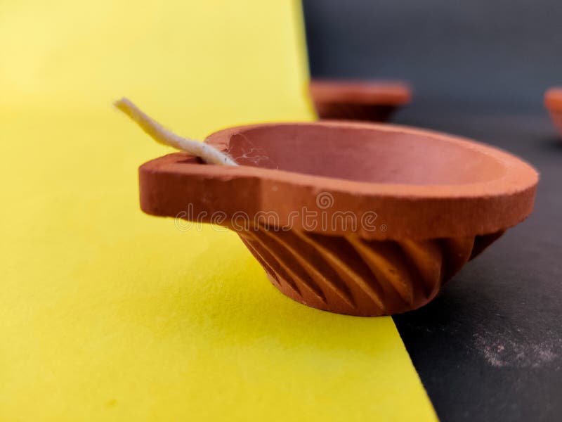 A Pattern Clay Lamp with Wick Isolated on Yellow Stock Image - Image of ...