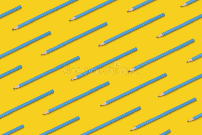 Pattern Composition of Blue Pencils on a Yellow Background. Top View ...