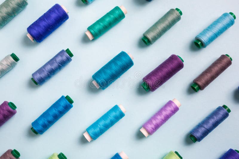 Pattern Composition with Sewing Threads on Color Background Stock Photo ...