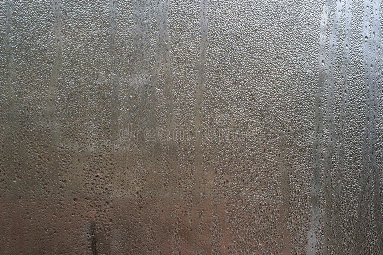 Pattern of Condensation Forms on a Chilled Glass Surface, with Water ...