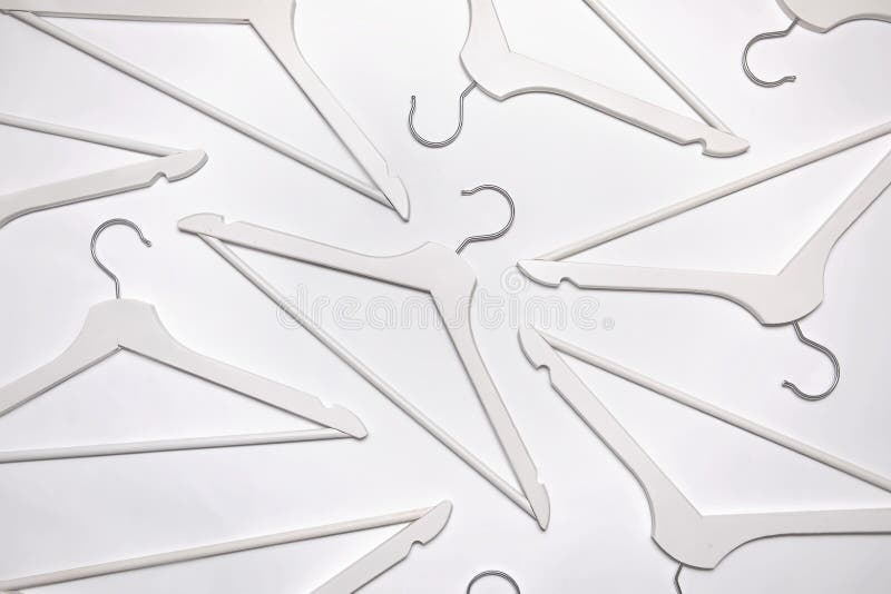 Pattern of Empty White Hangers Flat Lay on White Background. Abstract ...