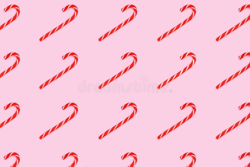 Pattern Made from Christmas Candy Canes Isolated on Pink. Stock Photo ...