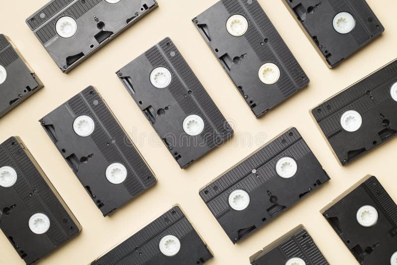 Pattern Made with Old Tape VHS Cassette on Color Background, Top View ...