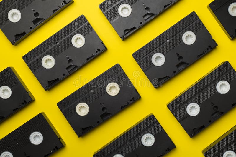 Pattern Made with Old Tape VHS Cassette on Color Background, Top View ...