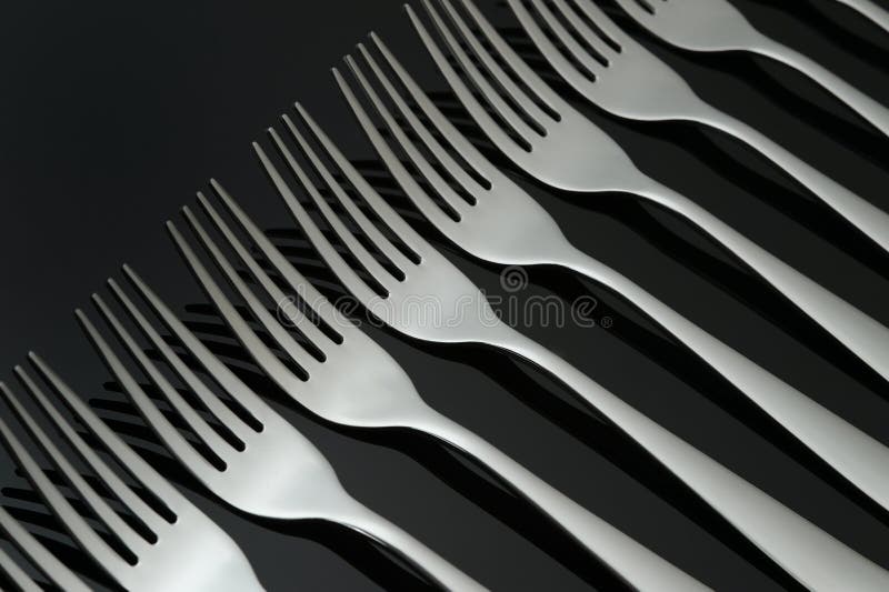 Pattern with Many Silver Forks on Black Mirror Background. Concept ...