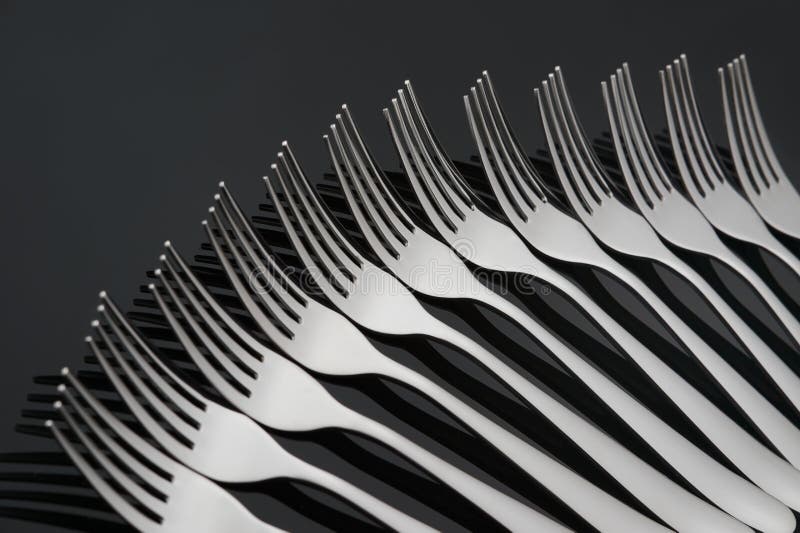 Pattern with Many Silver Forks on Black Mirror Background. Concept ...