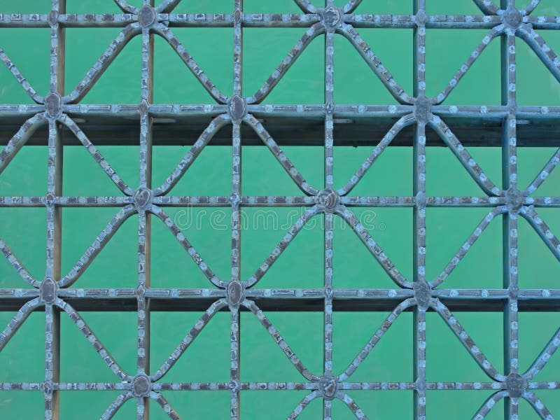 Pattern on a Metal Grate Over Blue Water Stock Photo - Image of steel ...
