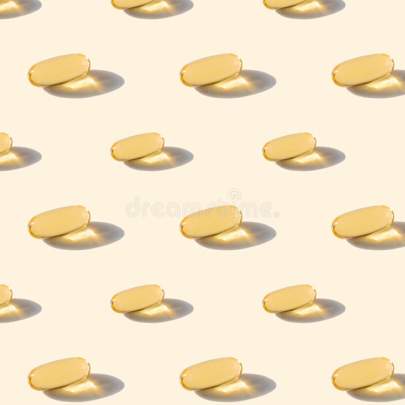 A Pattern of Omega Capsules on a Beige Background. Stock Photo - Image ...