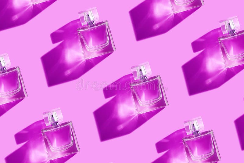 Pattern of Purple Perfume Bottle Laying on a Purple Background with a ...