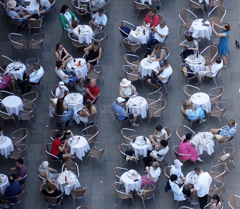 Interesting Aerial View of Tables and Chairs in Venice with People ...