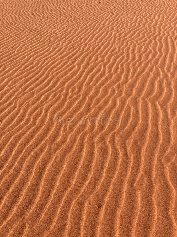 The Texture of Red Desert Sand and Sand Dunes in Wadi Rum, Jordan Stock ...