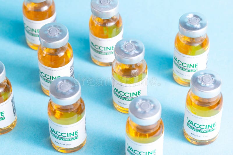 Pattern from a Vial with a Coronavirus Vaccine on a Blue Background ...