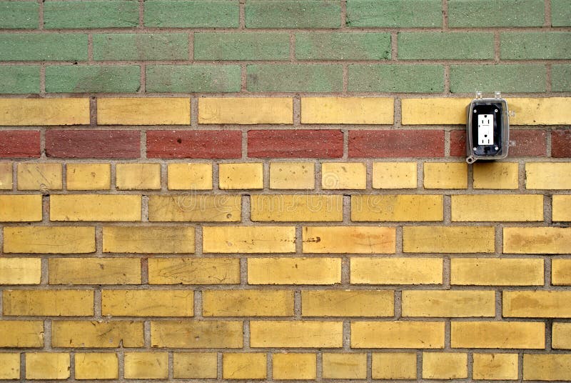 Pattern Wall of Coloured Bricks with Electrical Outlet Stock Image ...