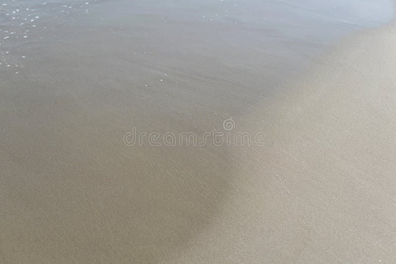 Pattern of Wet and Dry Sand on Sandy Beach. Stock Photo - Image of ...