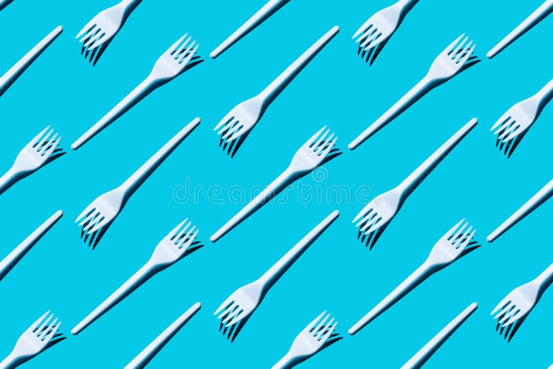 Pattern of White Plastic Disposable Forks on a Blue Background Stock ...