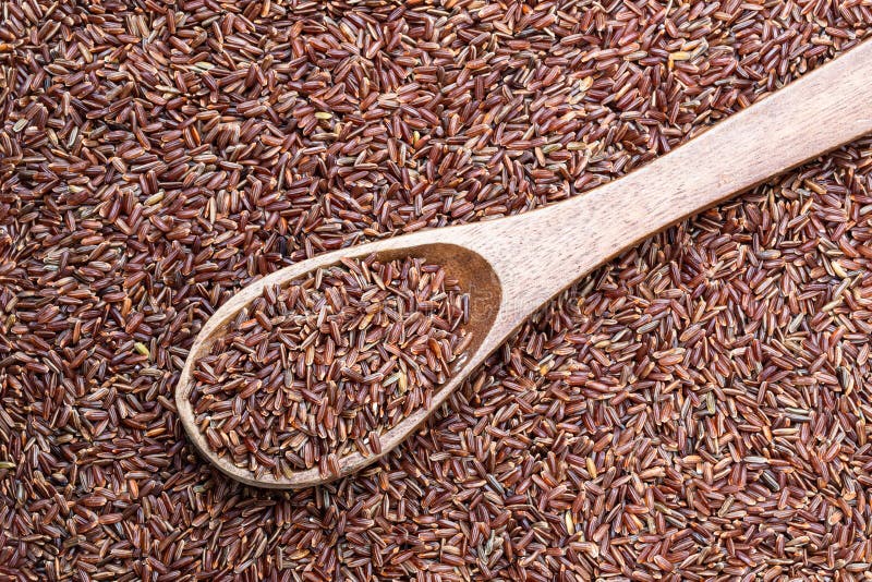 Pattern of Wild Red Rice with Wooden Spoon. Top View Stock Image ...