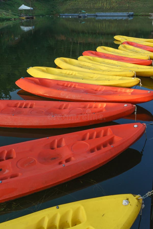 Pattern of Yellow and Red Kayaks on Dark Water Stock Image - Image of ...