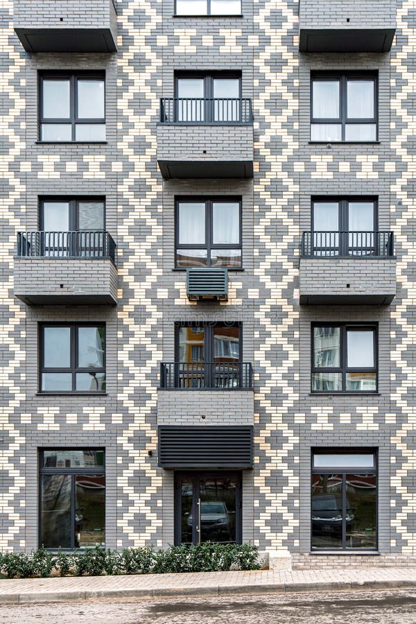 Patterned Building Facade with Balconies and Windows Stock Photo ...