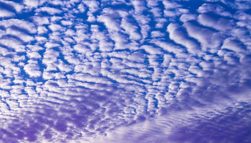 Patterned Fluffy Purple or Ultra Violet Clouds in Blue Sky Stock ...