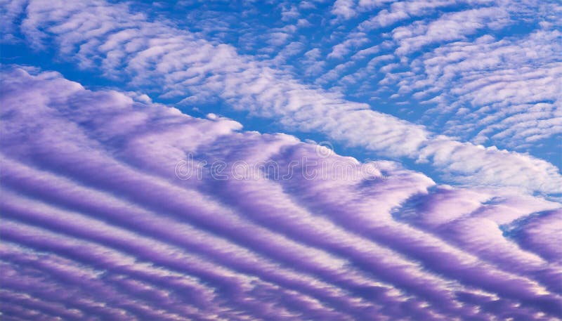 Patterned Fluffy Purple or Ultra Violet Clouds in Blue Sky Stock ...