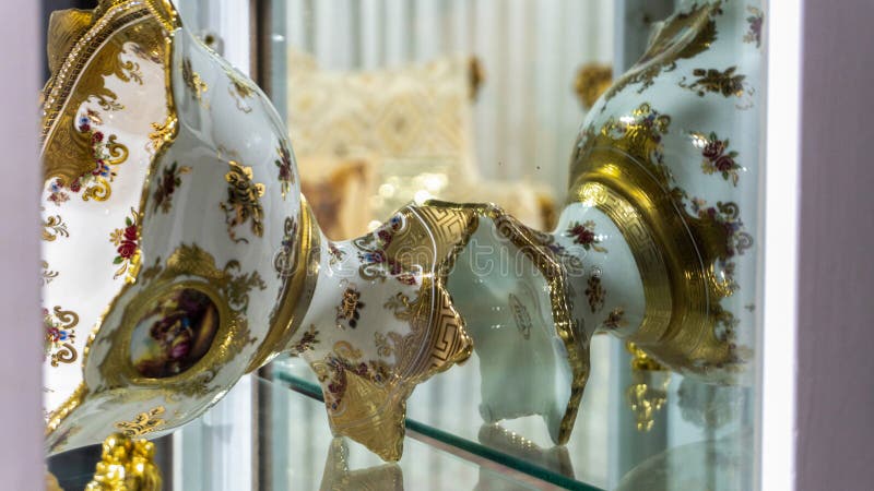 Patterned Glazed Porcelain in a Display Case. Designed Glass Container ...