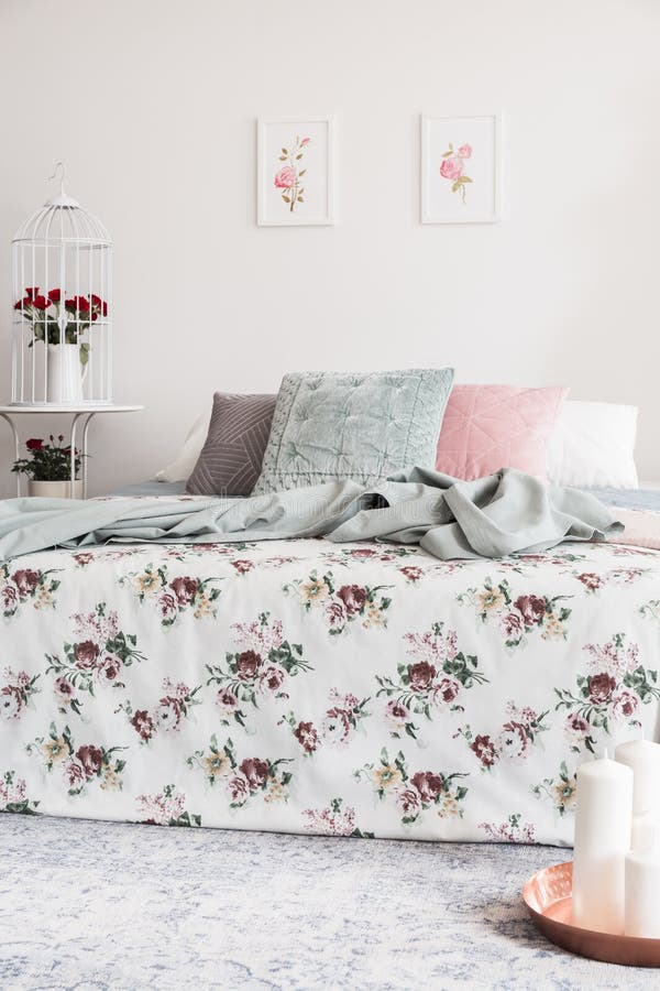 Patterned Sheets and Pillows on Bed in Feminine Bedroom Interior Stock ...