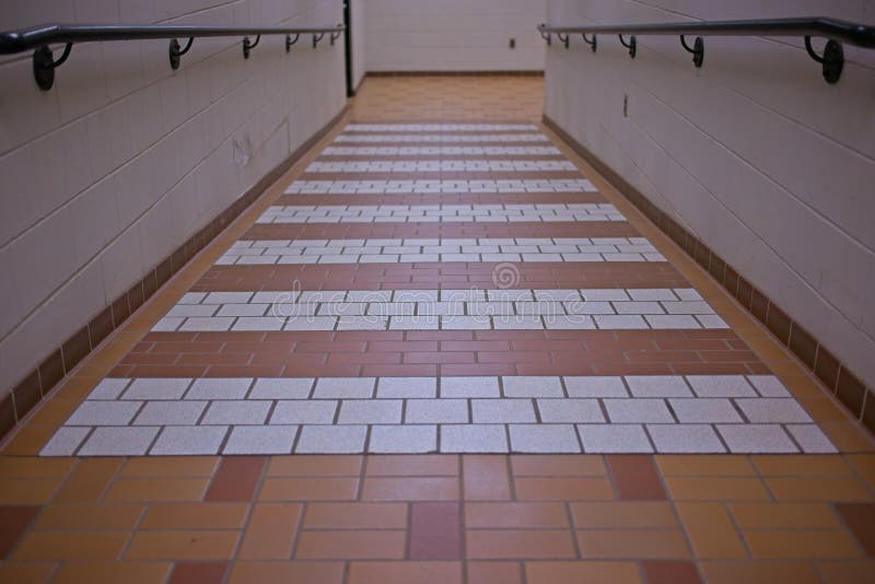 Patterned Tiled Corridor with Handrails Stock Image - Image of ...