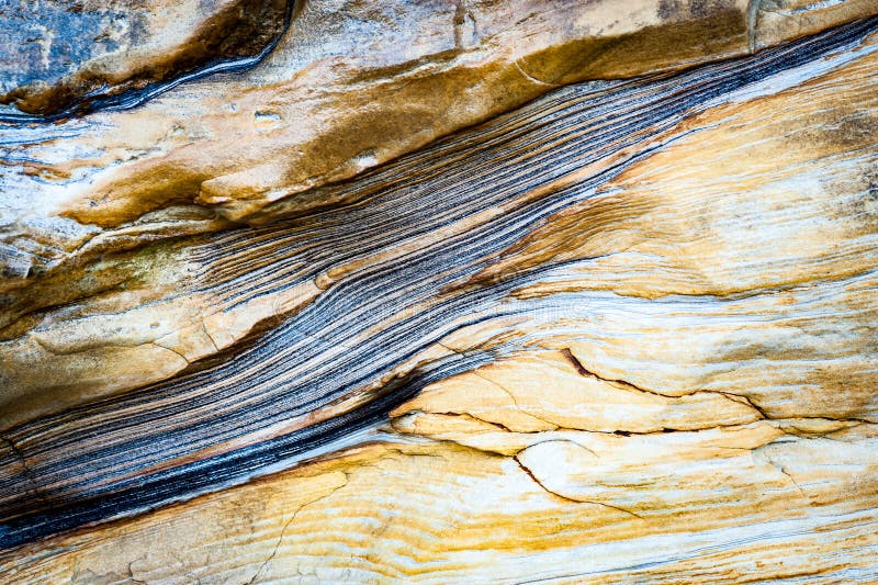 Patterns in cliff rock stock photo. Image of weathered - 64247994