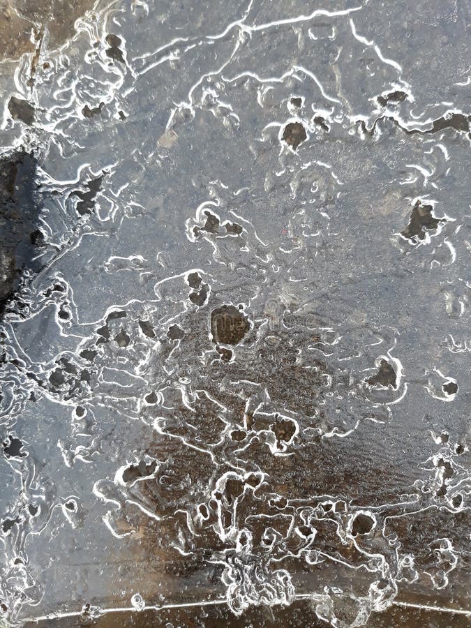 Patterns on frozen water stock photo. Image of abstact - 107653538
