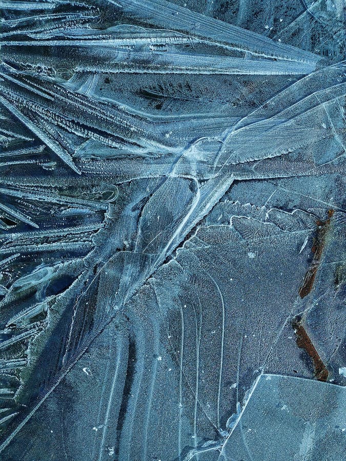 Patterns of Ice on a Frozen Puddle Stock Image - Image of winter ...