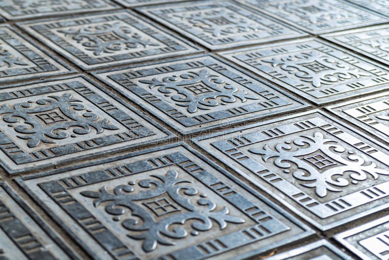Patterns on Large Metal Floor Plates on a Street of City Stock Photo ...