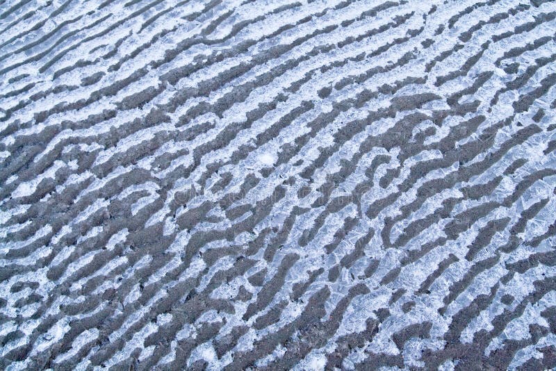 Patterns in the Sand from Waves from the Sea in Winter. Stock Photo ...