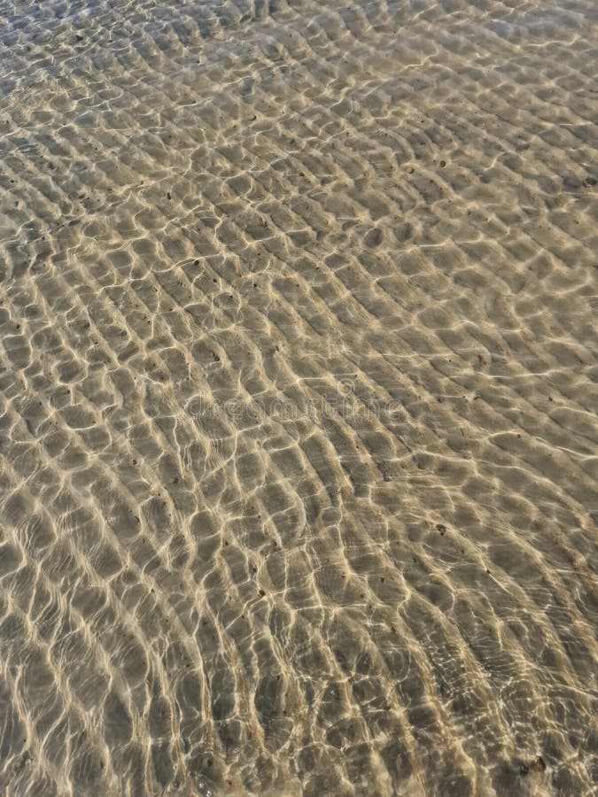 Patterns of Sunlight and Waves at the Beach Stock Image - Image of ...