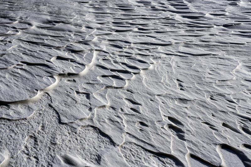 Wind blown snow patterns stock photo. Image of wind - 111433906