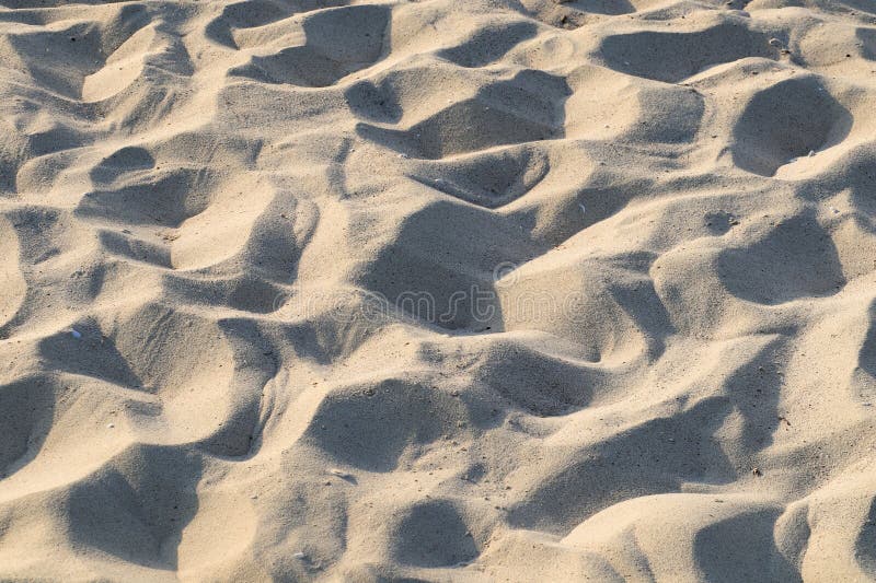 Patterns of Wind-Crafted Sand on Sunlit Beach Stock Photo - Image of ...