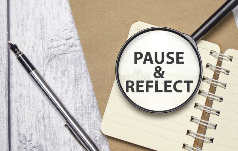 PAUSE and REFLECT Words on Magnifying Glass with Pen and Papers Stock ...