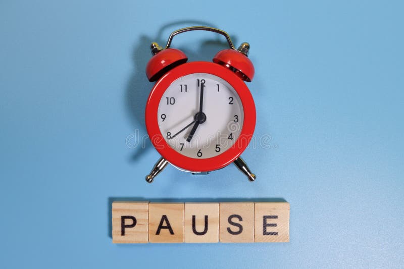 Pause Word and Alarm Clock on Blue Background Stock Photo - Image of ...