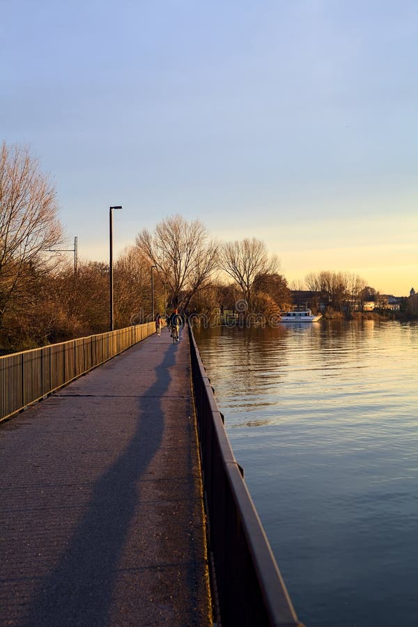 Paved Footbridge in a Park Over a Lake at Sunset Stock Photo - Image of ...